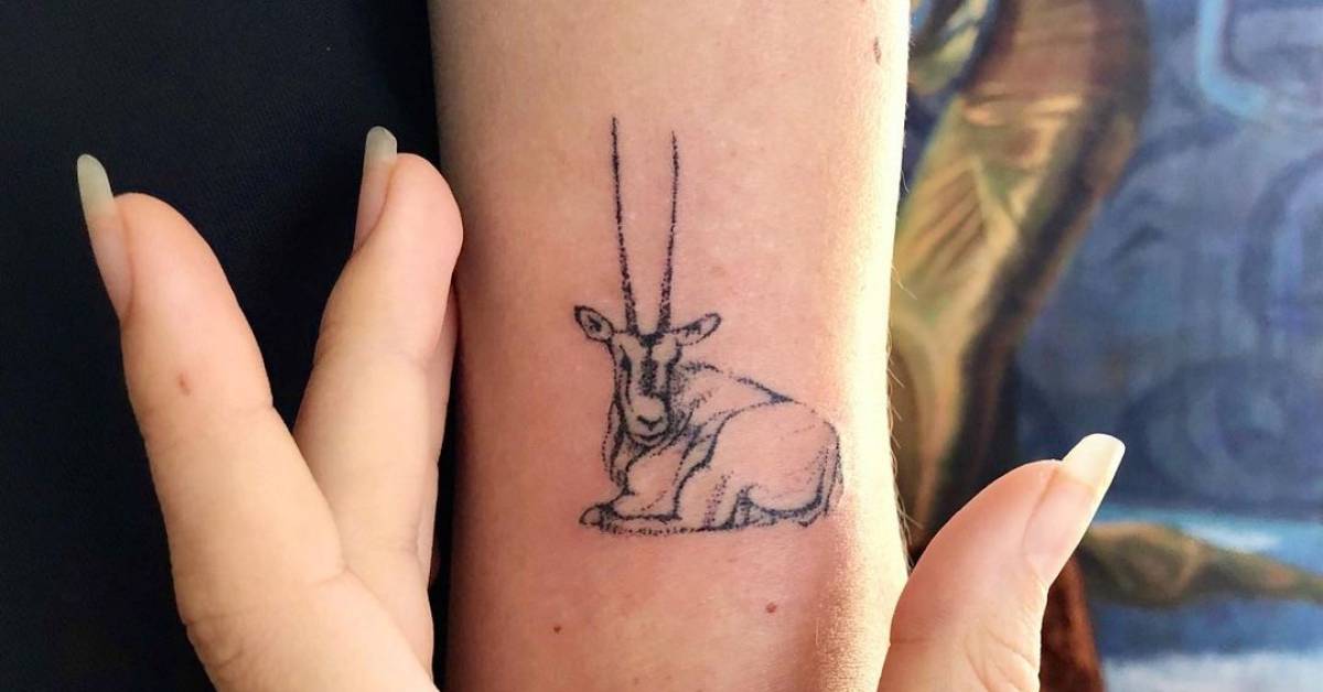 Hand poked antelope tattoo on the tricep.