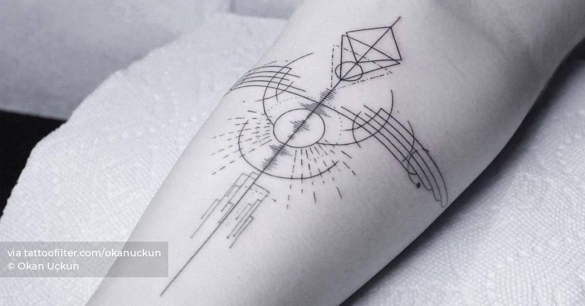 Geometric thunderbird tattoo on the inner forearm.