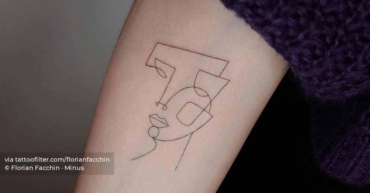 Fine line face tattoo on the inner forearm.