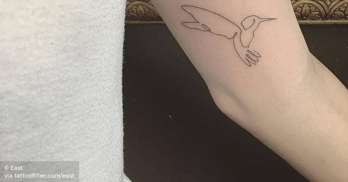 Continuous line hummingbird tattoo on the left inner