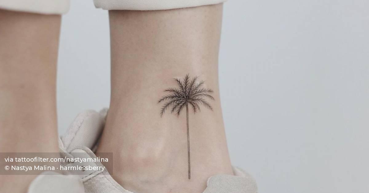 Fine line palm tree tattoo on the ankle.