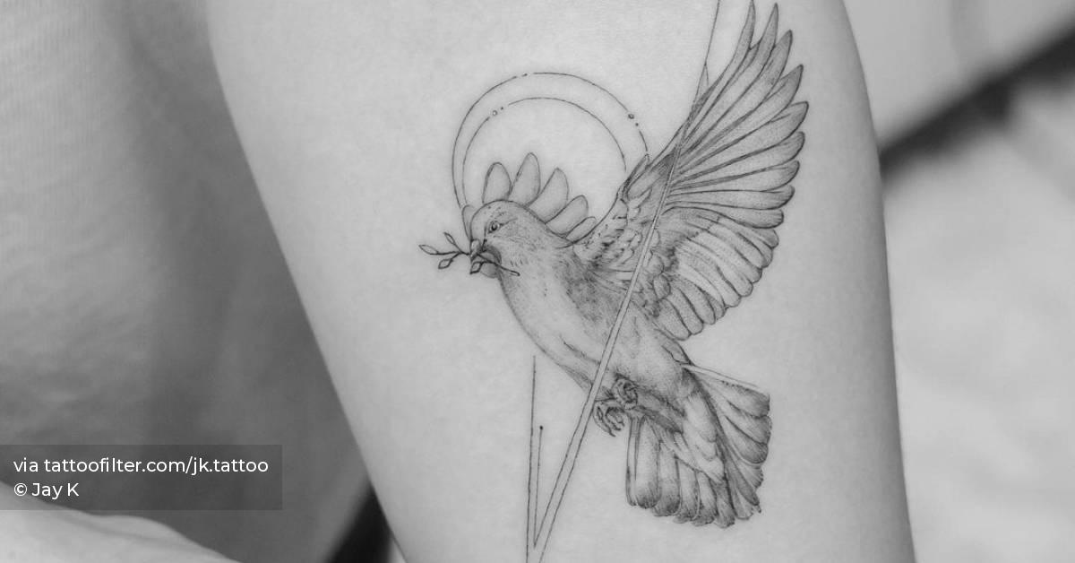 Fine line dove tattoo on the inner forearm.