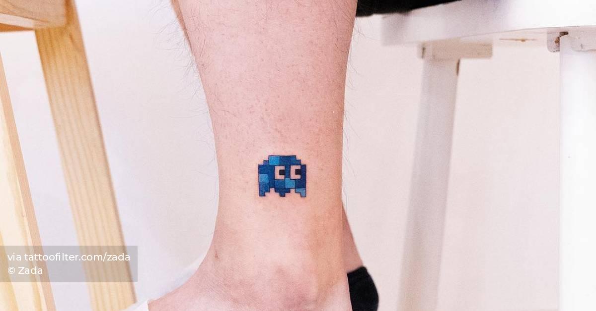 Pac Man's ghost tattoo on the ankle.