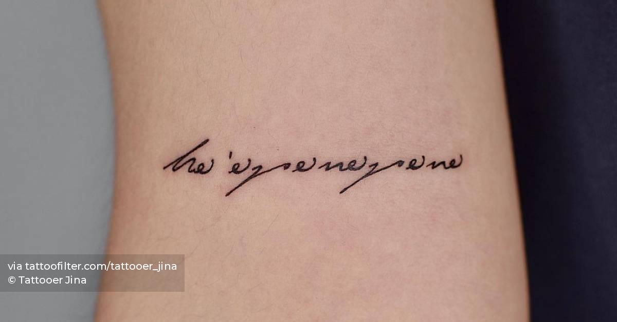 Lettering tattoo on the bicep.