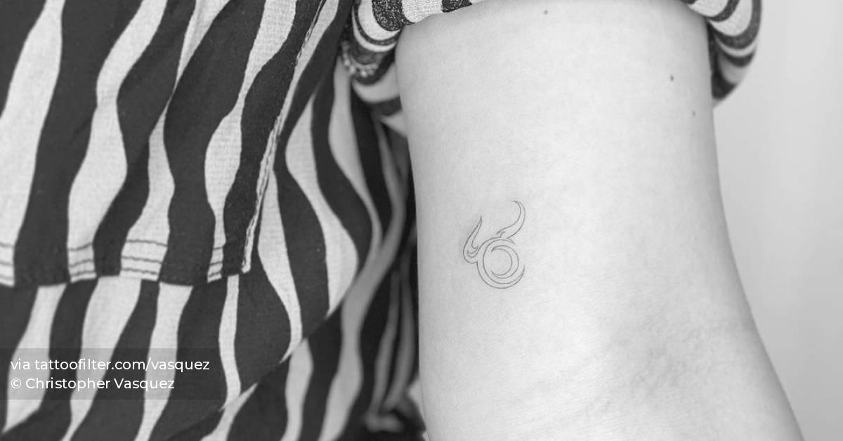 Taurus zodiac symbol tattoo on the inner arm.
