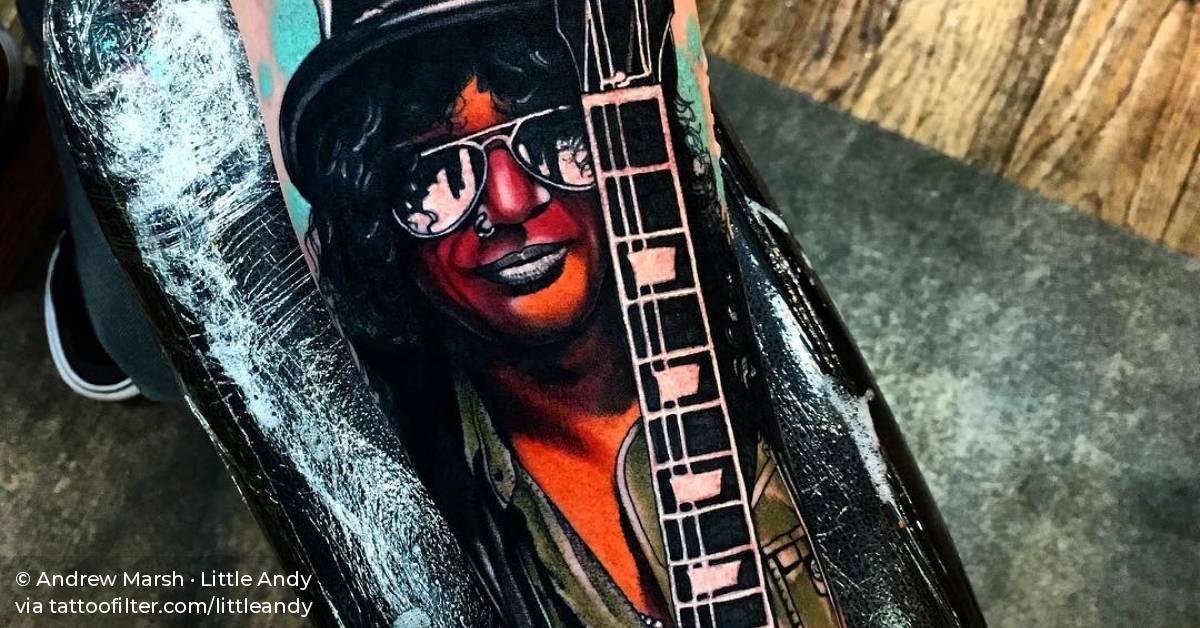 Slash tattoo on the inner forearm.