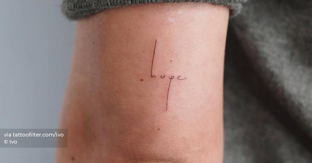 "Hope" lettering tattoo on the tricep.