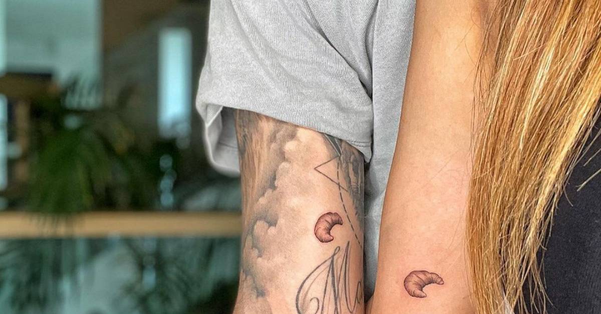Matching micro-realistic croissant tattoo for Isco and