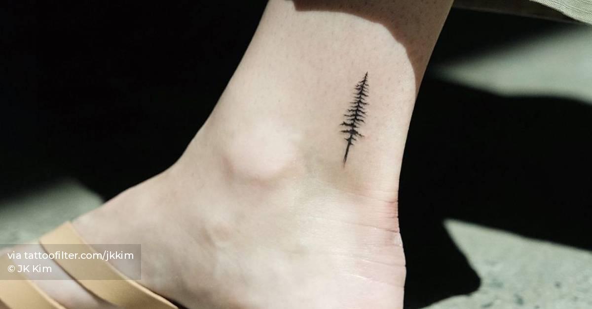 Fine line pine tree tattoo on the ankle.