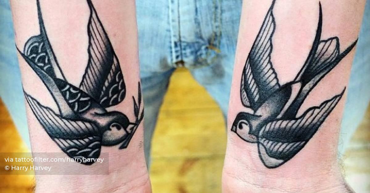 Traditional individual matching swallows tattooed on