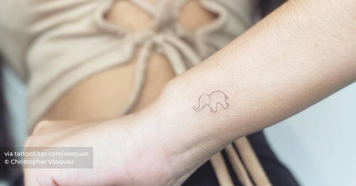 Fine line elephant tattoo on the wrist.