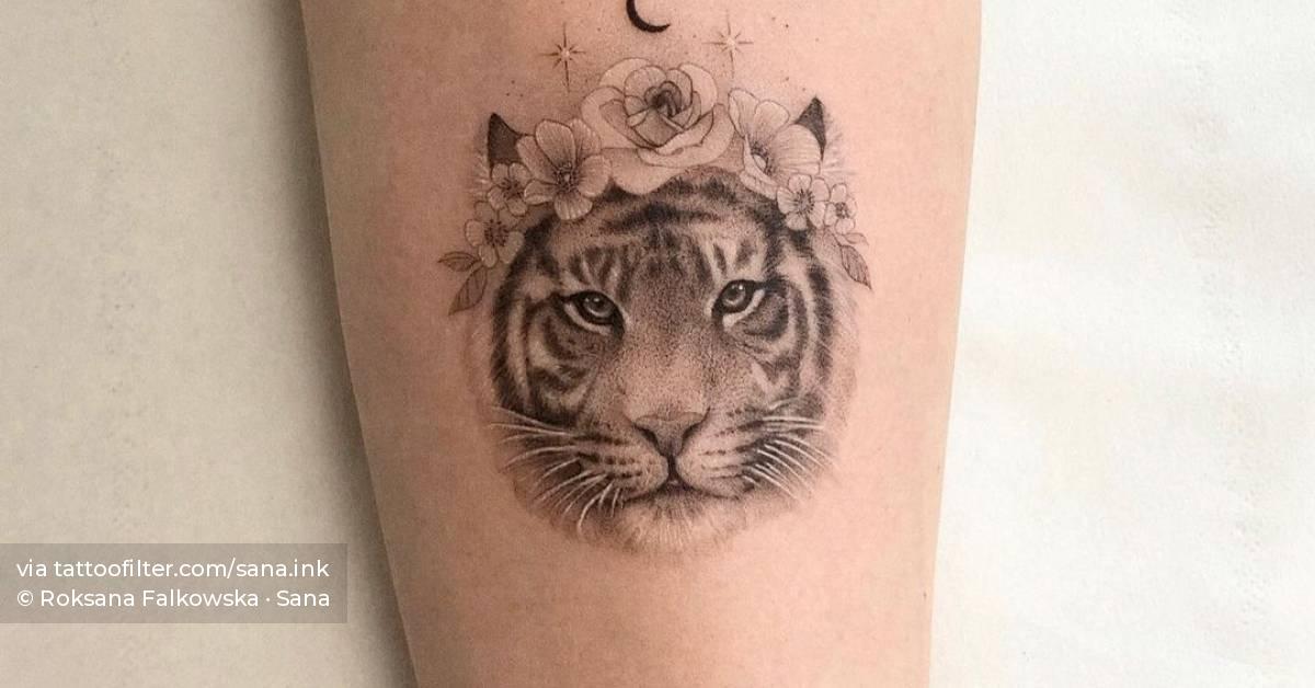 Micro-realistic tiger portrait tattoo on the inner