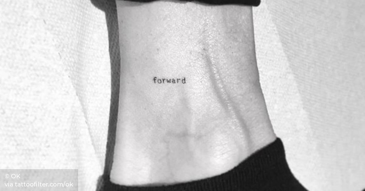 "Forward" tattoo on the ankle.