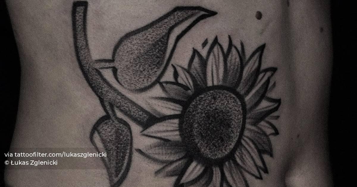 Sketch work sunflower tattoo on the rib.
