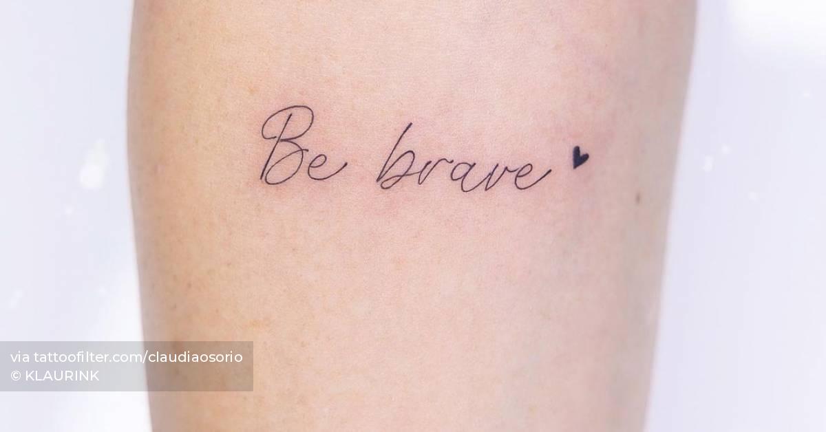 "Be brave" lettering tattoo on the inner forearm.