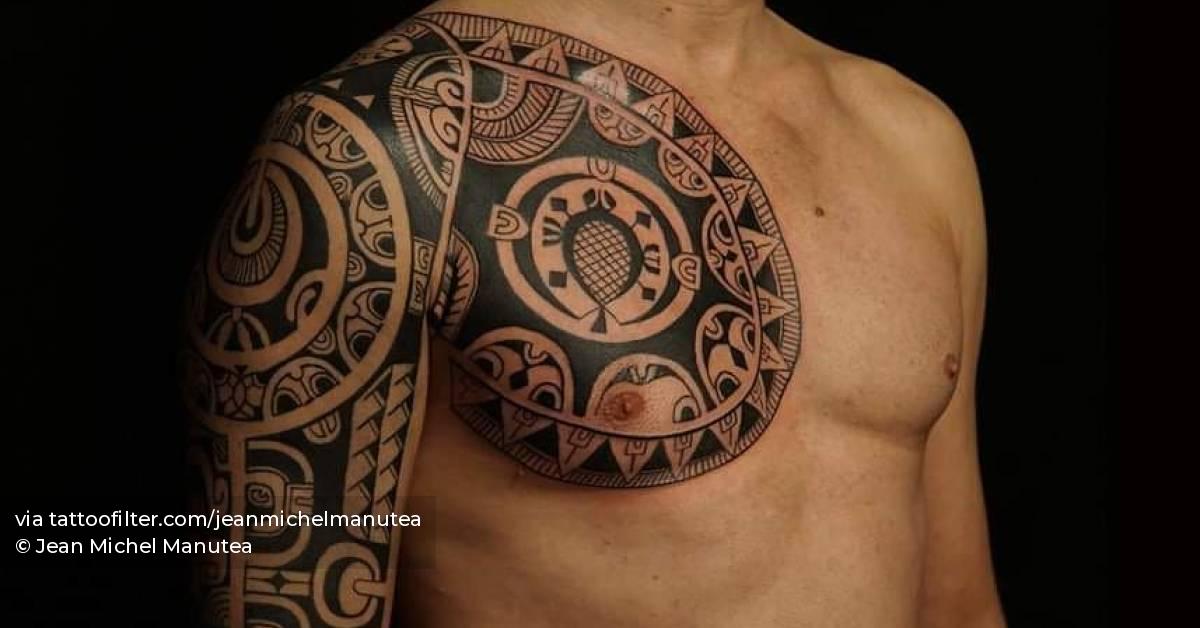 Maori style half sleeve and chest tattoo.