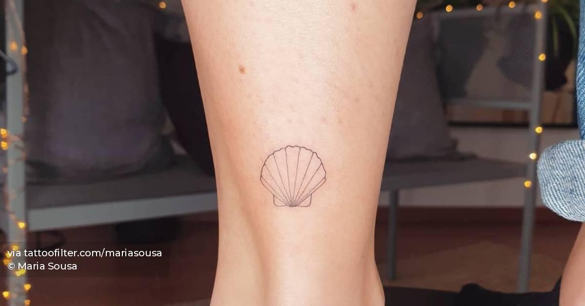 Fine line shell tattoo on the achilles.