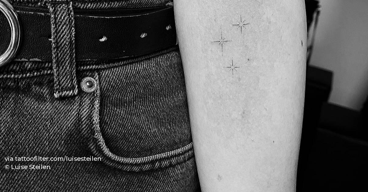 Minimalist north star tattoo on the inner forearm.