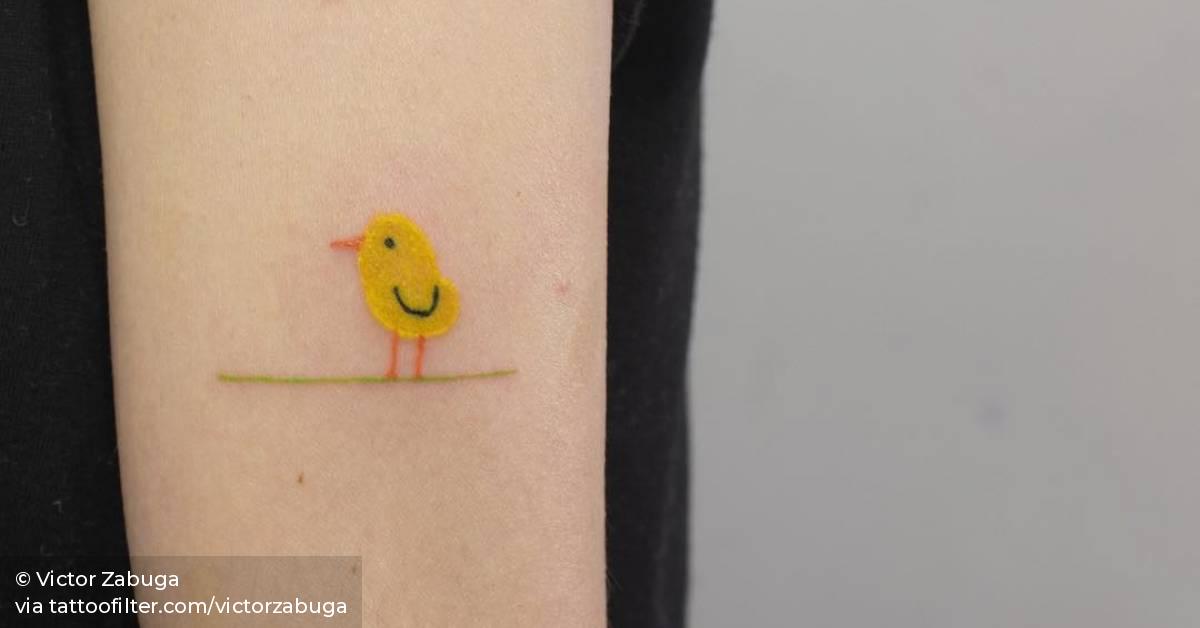 Chick tattoo on the left upper arm.