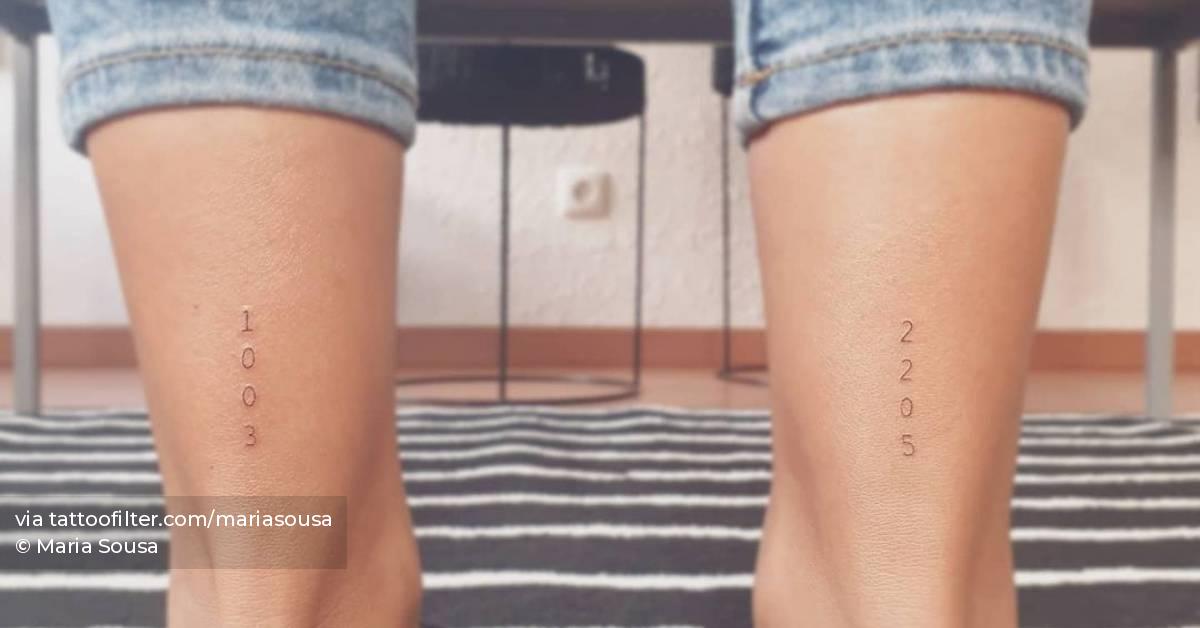 Dates lettering tattoo on the achilles.