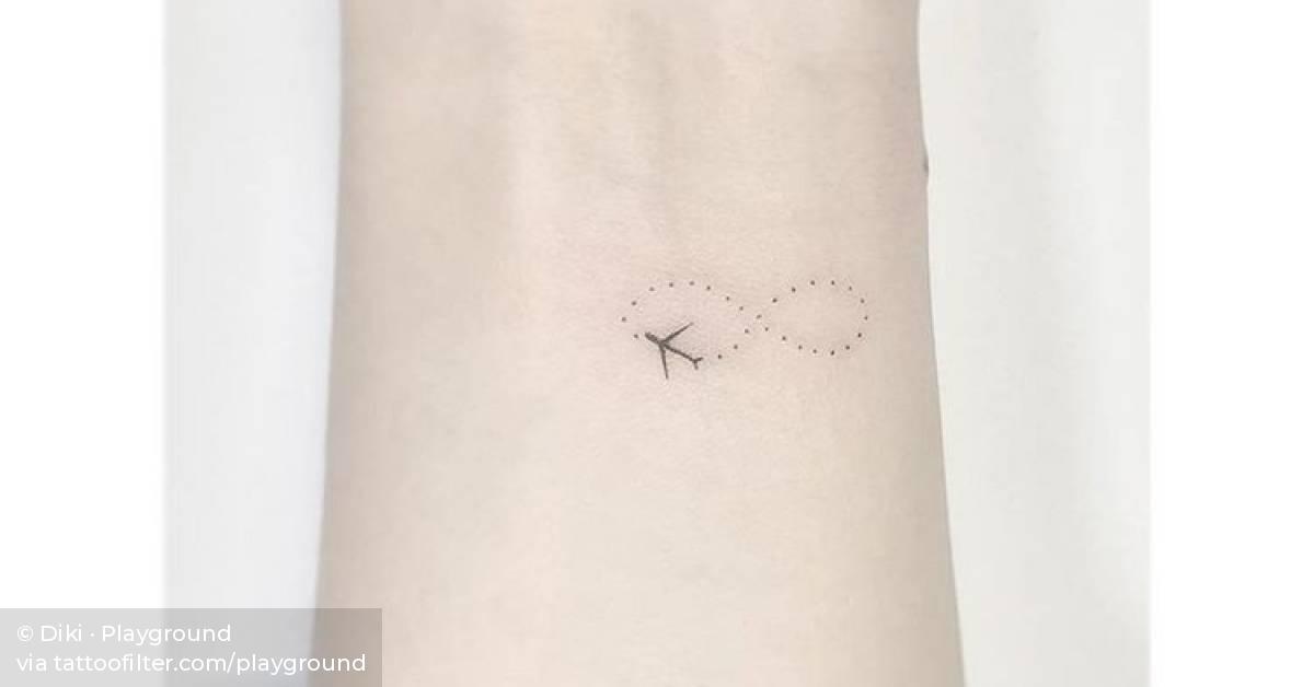 Airplane infinity tattoo on the inner wrist.