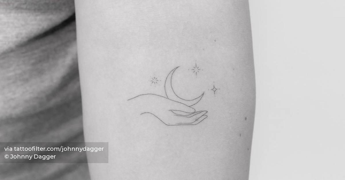 Fine line hand and moon tattoo on the inner forearm.