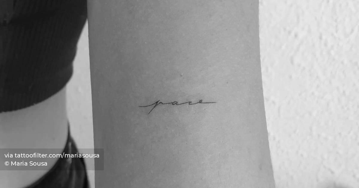 "Pace" lettering tattoo on the bicep.