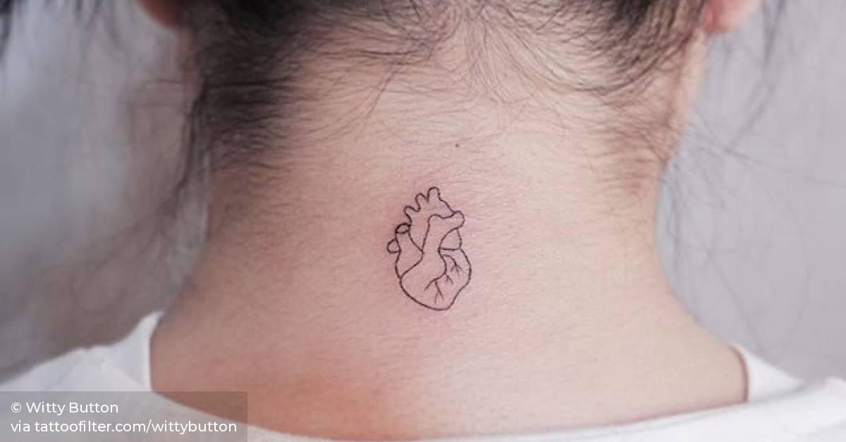 Fine line anatomical heart tattoo on the back of the