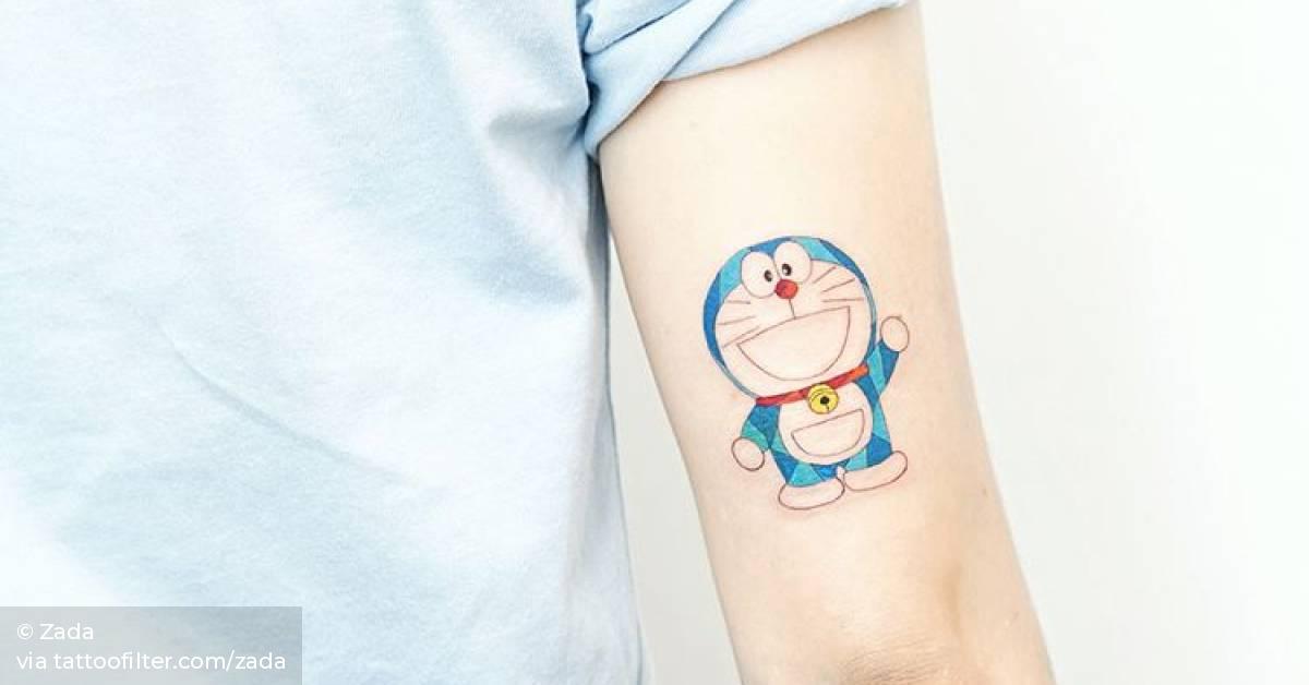 Doraemon tattoo on the back of the right arm.