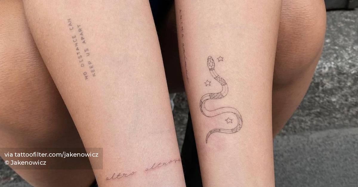 Single needle snake and lettering tattoo on the inner