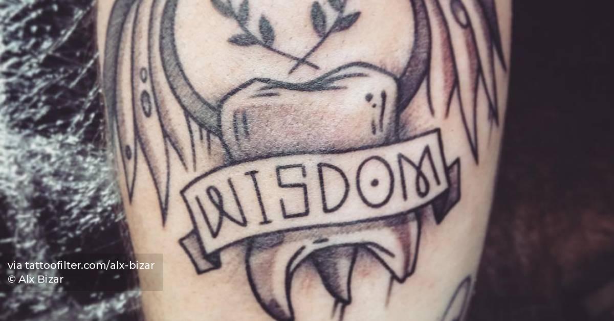 Wisdom tooth tattoo on the forearm.