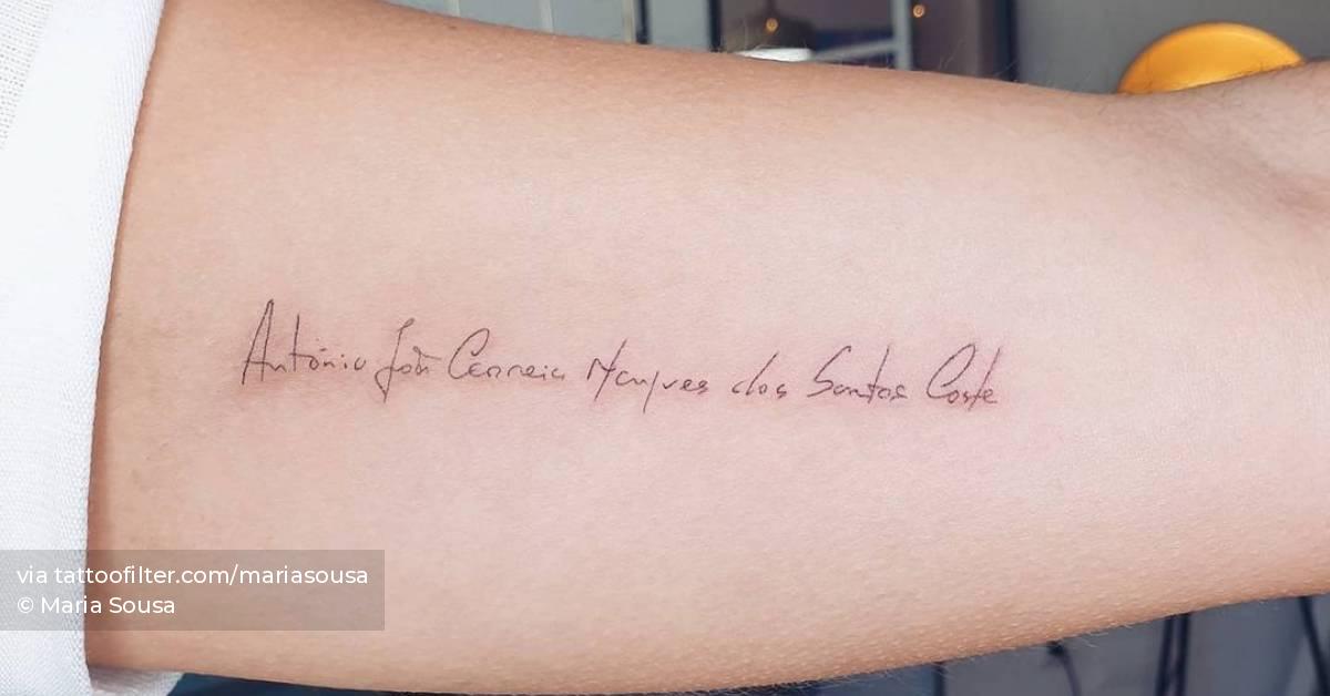 Signature tattoo on the inner arm.