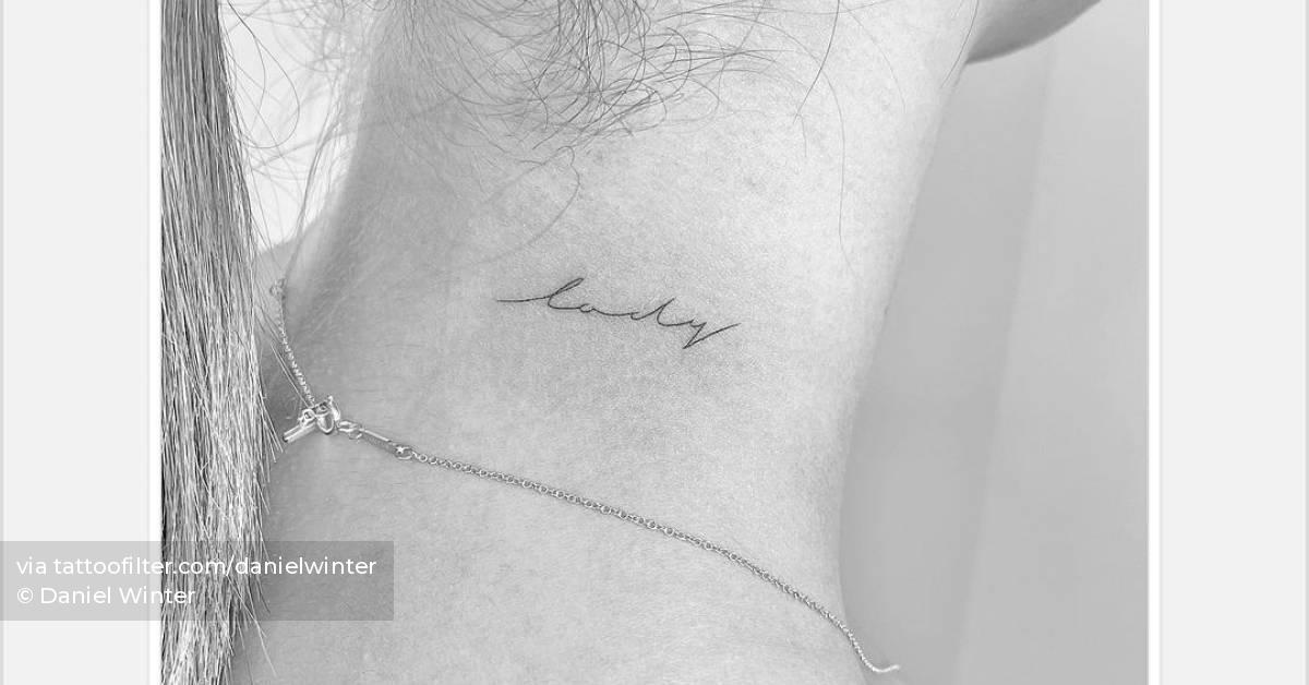 "Lady" lettering tattoo on the neck.