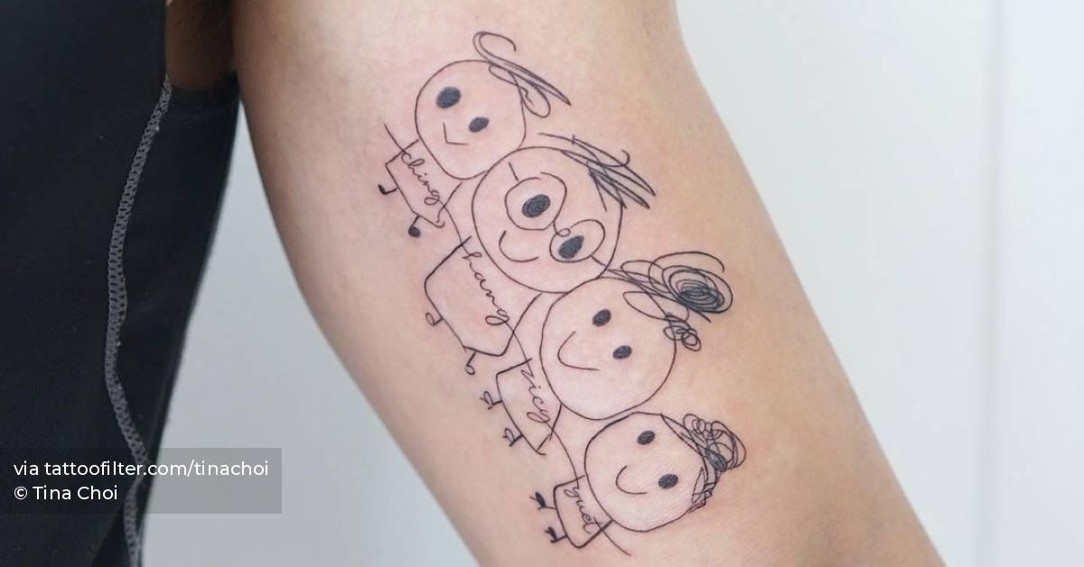 Child's drawing tattoo on the inner arm.