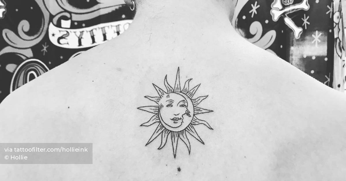 Sun and moon tattoo on the upper back.