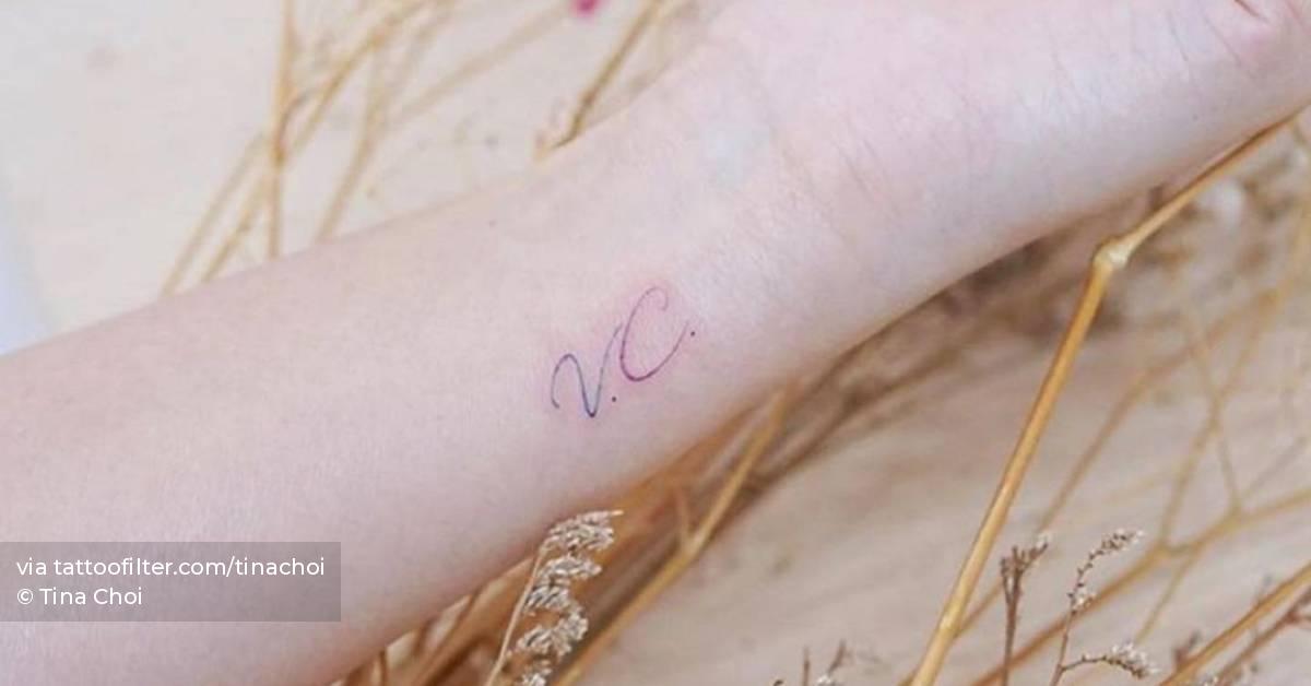 Initials tattoo on the wrist.