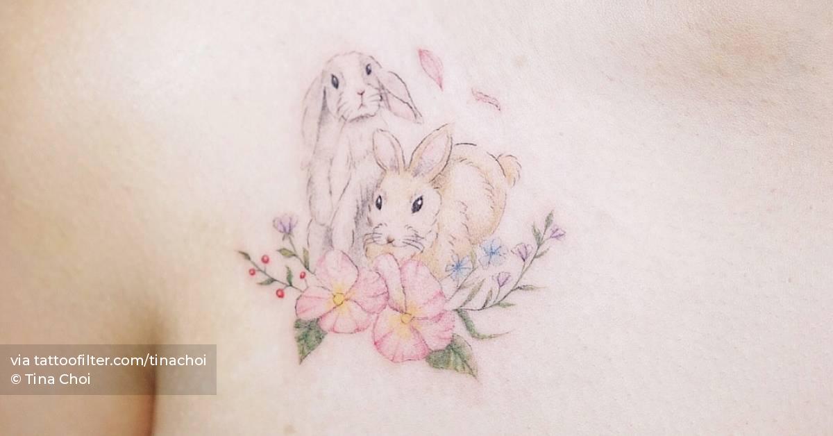 Watercolor rabbits tattoo on the chest.