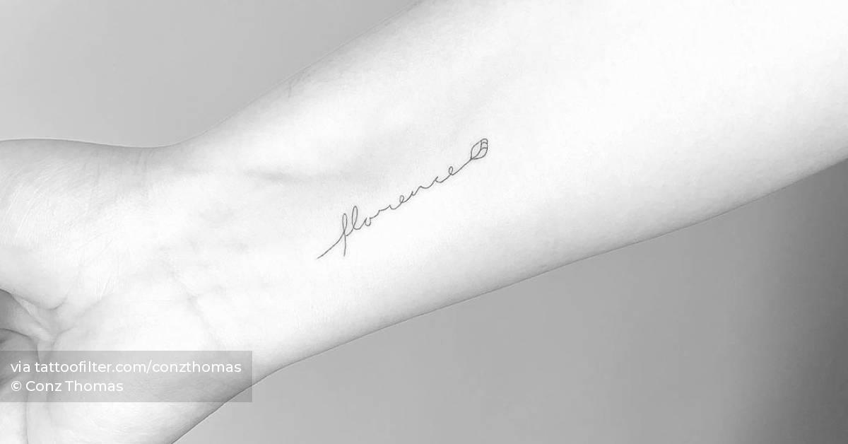 "Florence" lettering tattoo on the wrist.