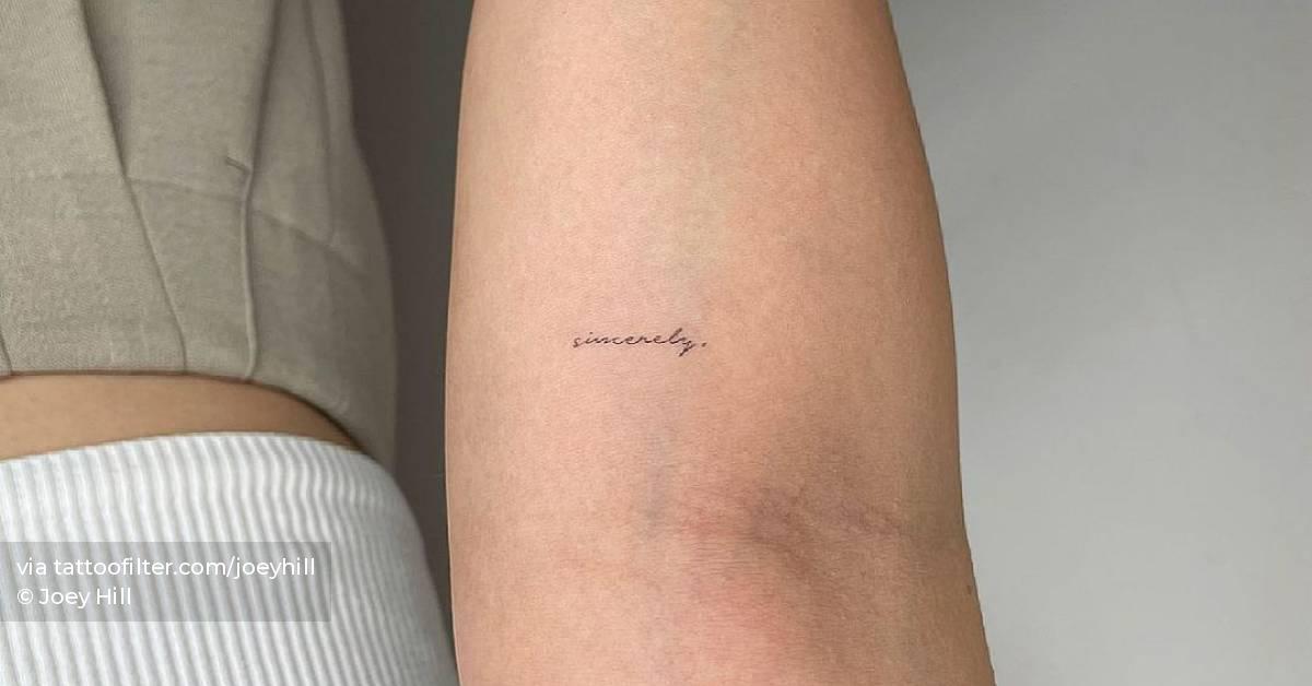 "Sincerely" lettering tattoo on the bicep.
