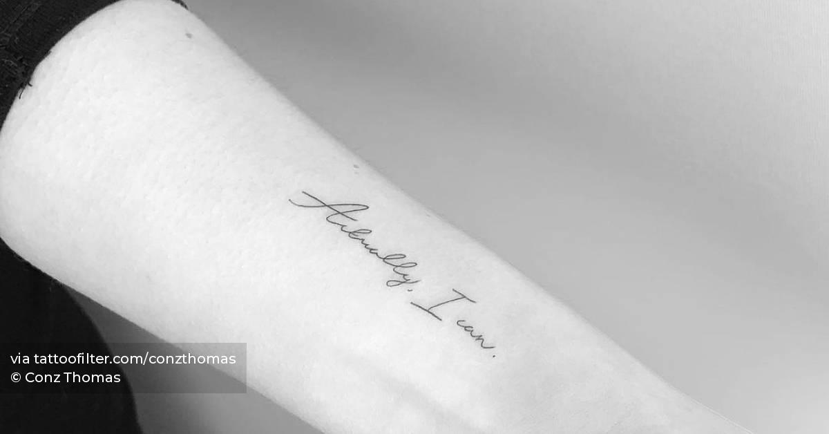 "Actually, I can" lettering tattoo on the inner