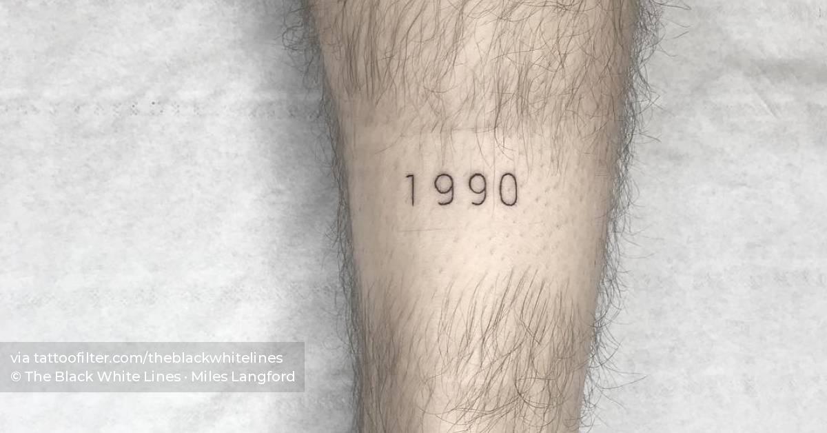 "1990" lettering tattoo on the achilles.