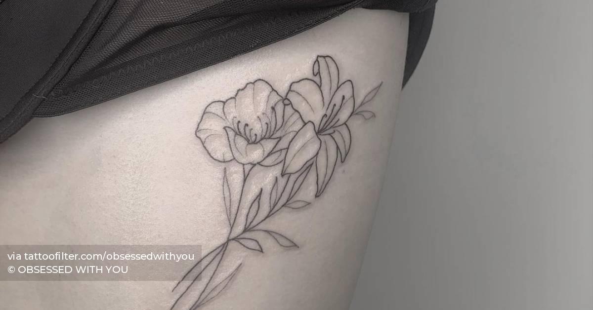 Line art poppy and lilly tattoo on the rib.