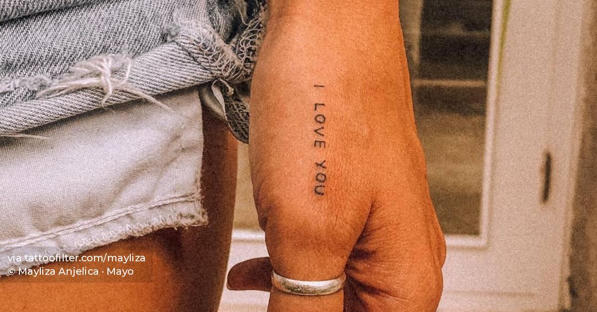 "I love you" lettering tattoo on the hand.
