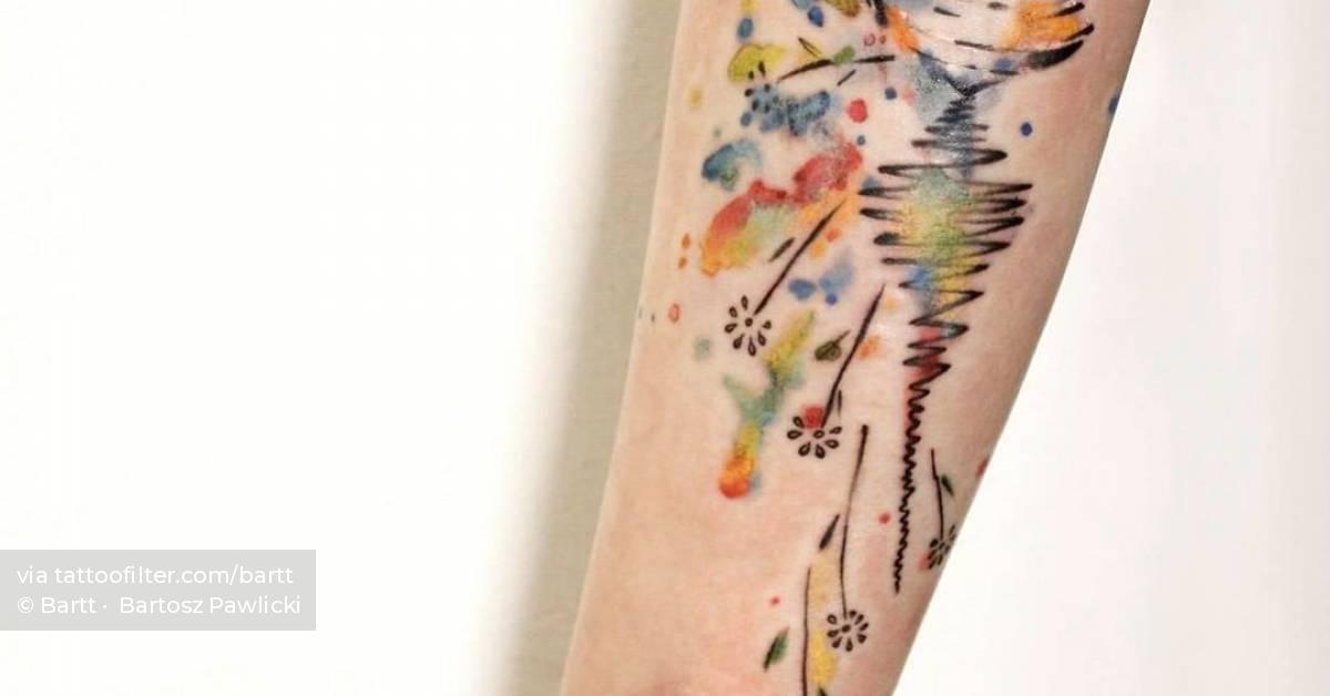 Abstract spinning top tattoo on the inner forearm.