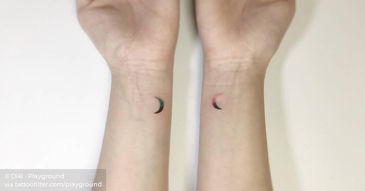 Matching moon tattoos.