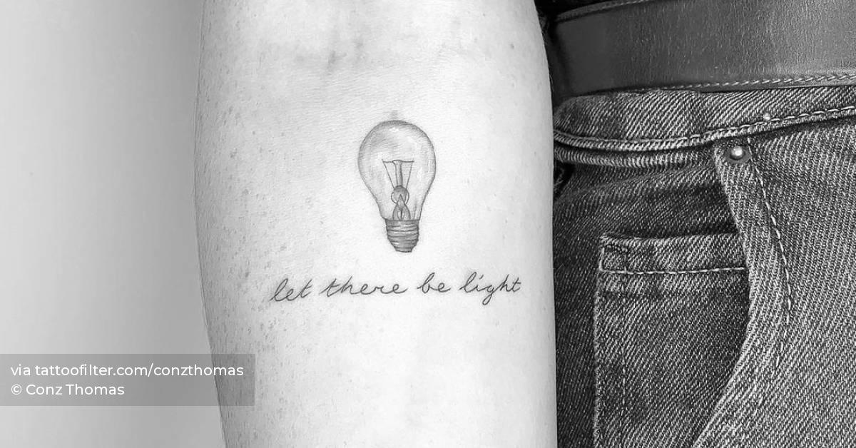 Micro-realistic light bulb tattoo on the inner forearm.