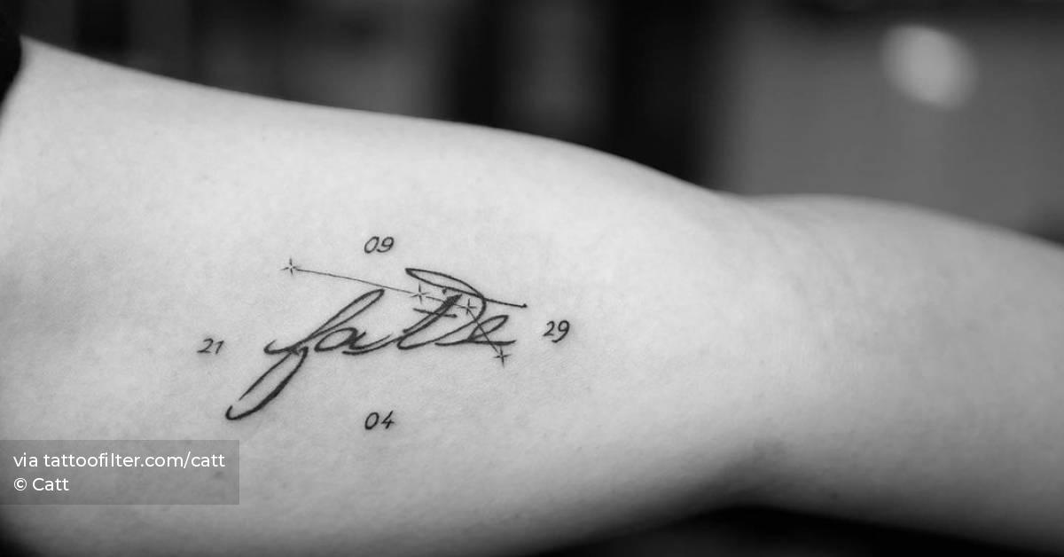 "Fate" lettering tattoo on the inner arm.