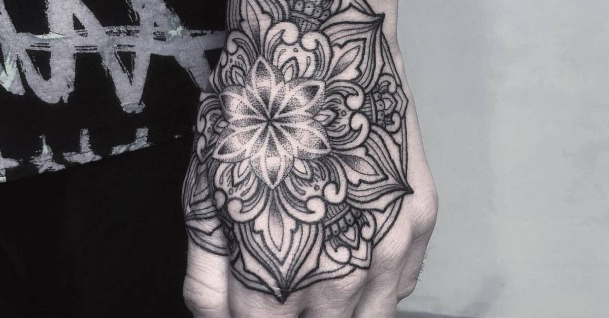 Mandala tattoo on the hand.