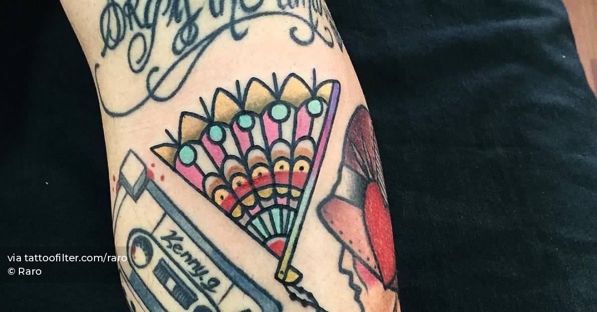 Traditional style hand fan tattoo on the inner forearm.