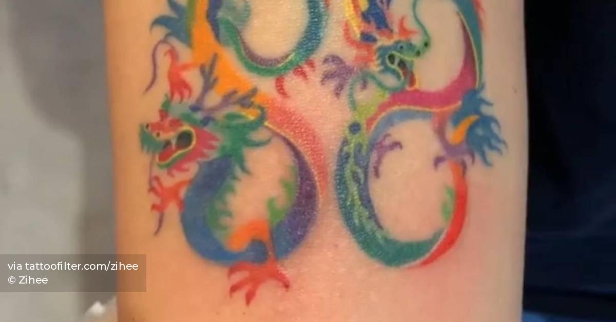Infinity dragon tattoo on the inner forearm (healed).